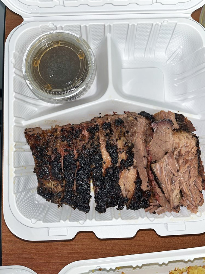 Brisket with bark so perfect it should be in a museum. The smoke ring isn't just pink—it's practically blushing from all the attention it deserves.