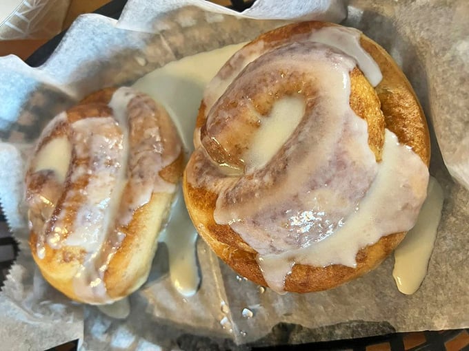These cinnamon rolls aren't just breakfast—they're dessert masquerading as morning food, with icing so generous it's practically formal attire. 