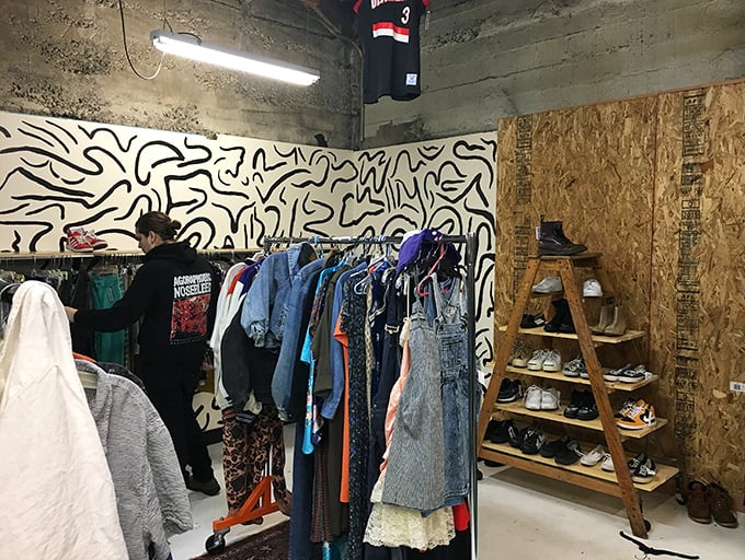 Abstract art meets fashion finds in this corner of cool. That wooden ladder of shoes isn't just storage—it's a stairway to style heaven.