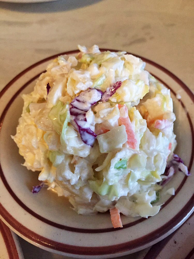 Coleslaw that actually tastes like vegetables instead of mayonnaise soup – crisp, colorful, and the perfect cool counterpoint to hot chicken.