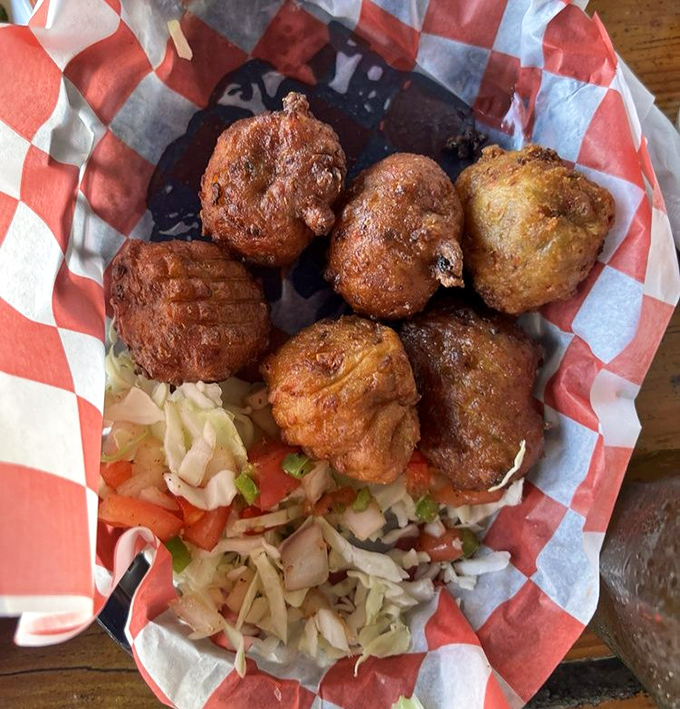 These conch fritters aren't just fried dough balls—they're little golden orbs of Keys history, served with a side of slaw and zero pretension.