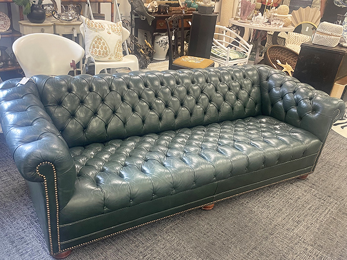 This tufted Chesterfield sofa in British racing green isn't just furniture—it's a statement piece that whispers, "I have opinions about proper tea."