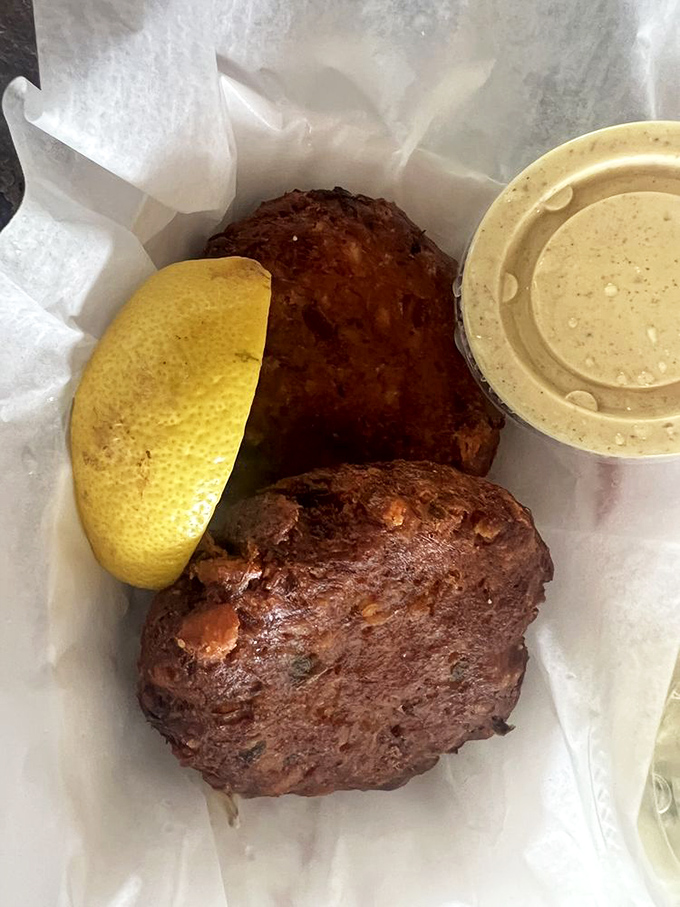 Crab cakes that are actually crab, not filler—a revolutionary concept that deserves its own holiday. That mustard sauce is liquid sunshine.