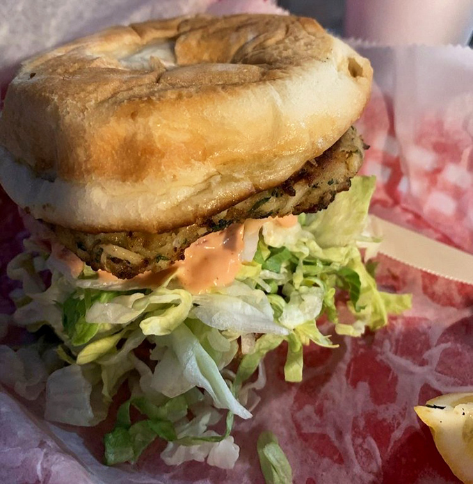 Not your average sandwich – this crab cake creation towers with fresh lettuce and secret sauce on a perfectly toasted bun.
