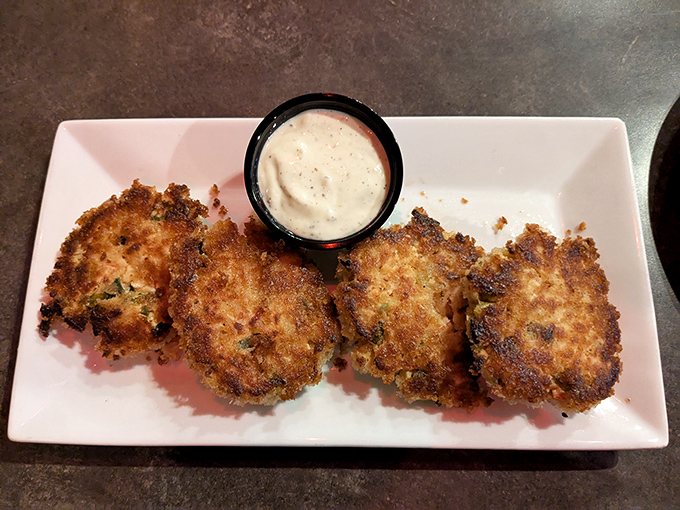 These golden-brown crab cakes aren't just fried, they're a crispy love letter to the sea – perfectly paired with that creamy dipping sauce.