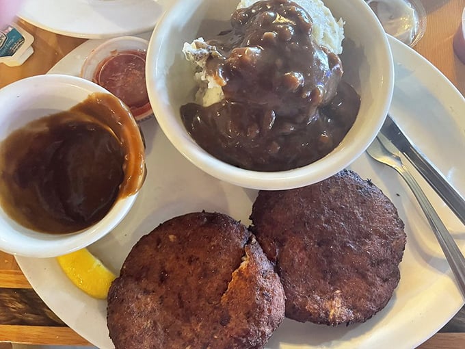 Crab cakes so authentic they should come with their own tiny Maryland passports and a side of gravy-smothered potatoes.