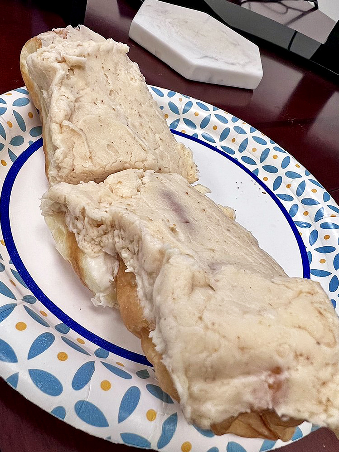 This cream-filled masterpiece isn't just a donut – it's an engineering marvel of pastry, filling, and frosting that demands to be savored.