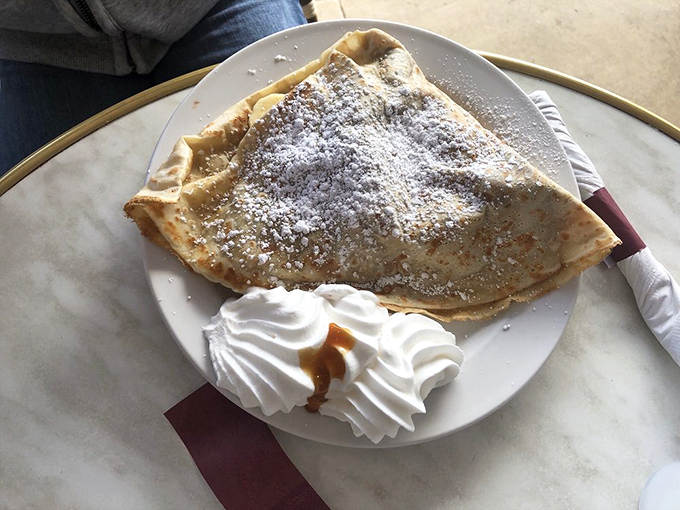 Sweet simplicity at its finest—a crepe that proves sometimes all you need is good butter, sugar, and a little whipped cream to find happiness.