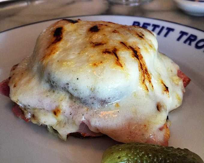 The Croque Monsieur at Petit Trois doesn't just satisfy hunger—it resolves existential crises. Melted cheese bronzed to perfection atop quality ham makes ordinary sandwiches seem pointless.