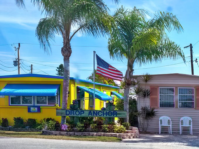 Drop Anchor and stay awhile—this sunny yellow cottage with its American flag seems to whisper, "Slow down, you're on island time now."
