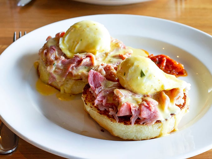 Eggs Benedict elevated to an art form—that hollandaise cascading down like a buttery waterfall of breakfast dreams.