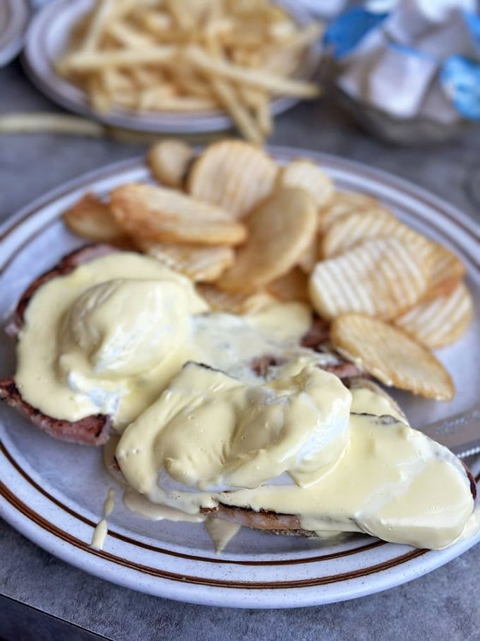 Hollandaise sauce cascades over what might be Long Beach's most indulgent breakfast—a rich benediction to start your day with zero regrets.