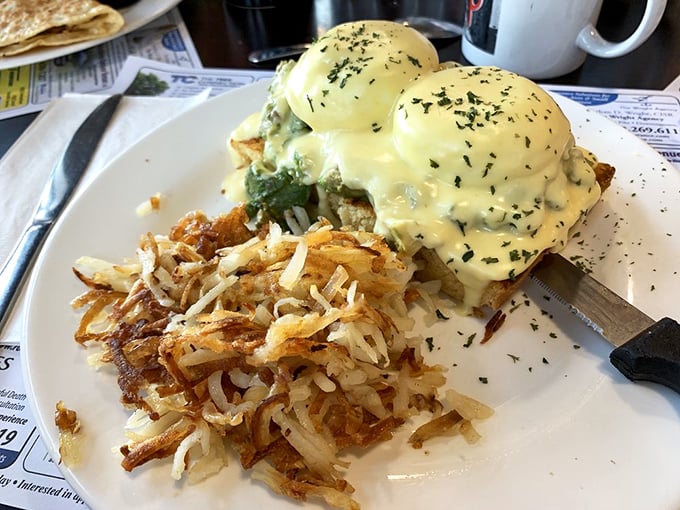 Eggs Benedict done right: perfectly poached eggs crowned with hollandaise that would make Julia Child weep with joy.