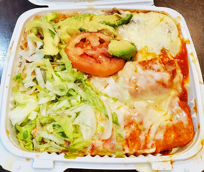 Not just enchiladas, but a work of art—where melted cheese meets fresh lettuce in a dance as old as California itself.