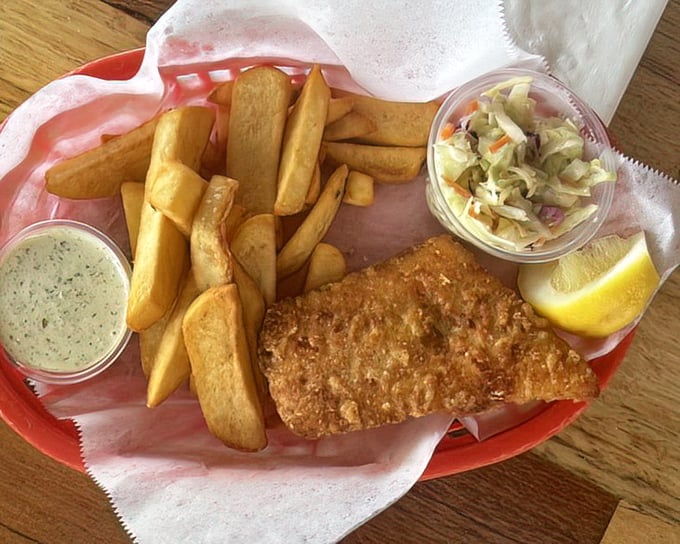 Classic fish and chips with a side of coleslaw—simple perfection that would make a British pub-goer weep with joy.