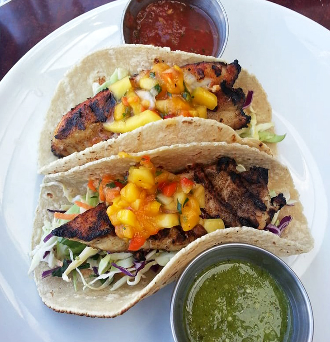 Fish tacos that bridge cultures and flavors – grilled perfection topped with vibrant mango salsa that makes your taste buds feel like they're on a tropical vacation.