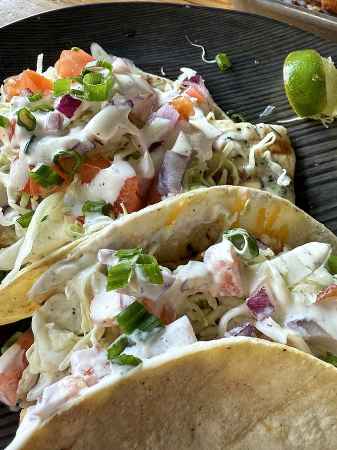 Taco Tuesday has nothing on these everyday masterpieces. Fresh fish nestled in warm tortillas with that signature slaw—simplicity at its most delicious.