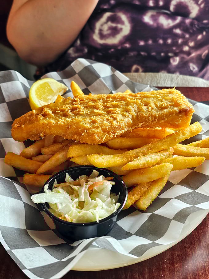 Golden-battered fish and crispy fries that would make a British pub jealous, served with the kind of coleslaw that converts skeptics.