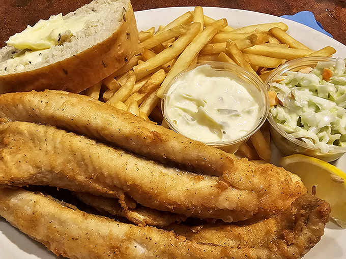 Golden-battered perch served with the holy trinity of Wisconsin sides—french fries, coleslaw, and a slice of buttery garlic bread. Friday night perfection.