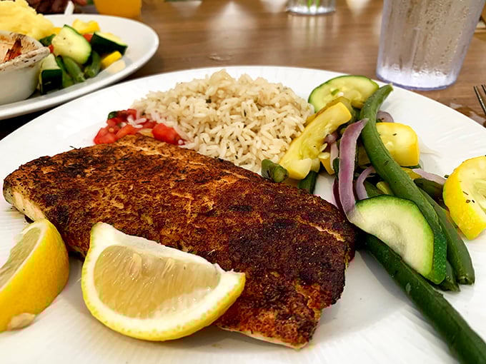 Blackened perfection meets colorful companions—this fish doesn't need a passport to take your taste buds on a vacation.
