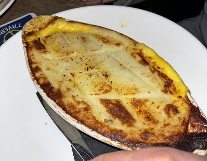 Comfort food gets the coastal treatment. This golden-topped pie hides a treasure of flavors beneath its burnished surface—the ocean's bounty reimagined.