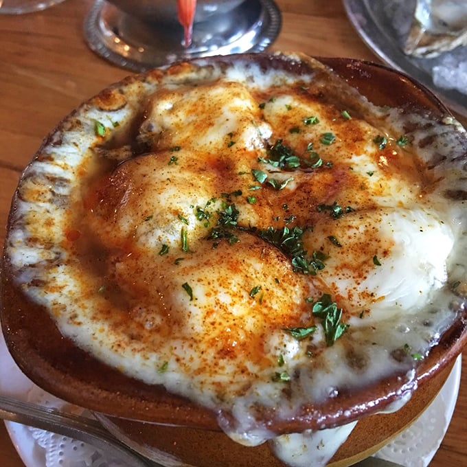 Bubbling cheese creates a magnificent crown atop this French onion soup. Breaking through reveals a rich, beefy broth and caramelized onions that took their sweet time getting this delicious.