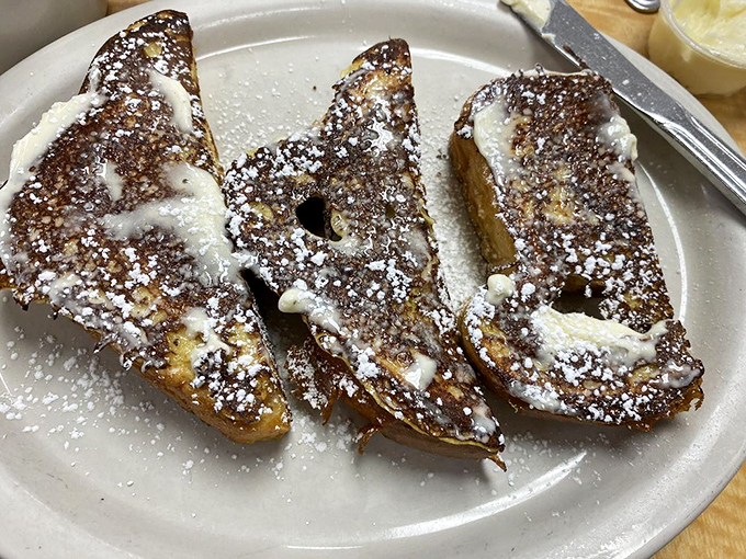 French toast that's dressed for success with a dusting of powdered sugar and what appears to be the perfect balance of crispy edges and tender center.
