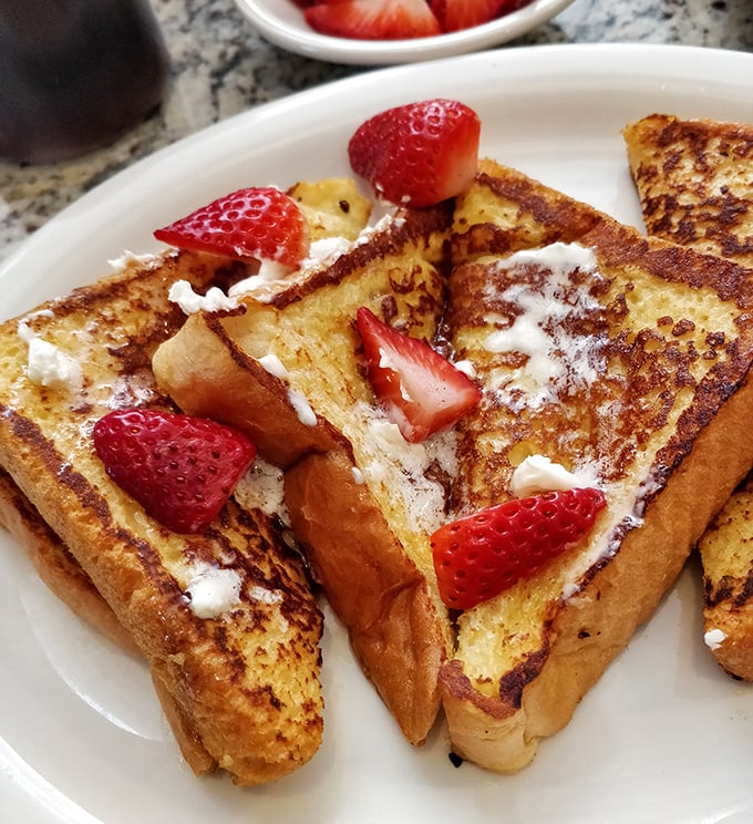 French toast that's dressed for success with fresh strawberries and a dusting of powdered sugar – breakfast or dessert? Why choose?