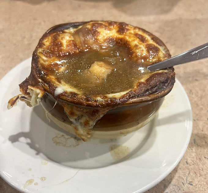 French onion soup with a cheese pull that deserves its own Instagram account – bubbling, golden, and ready to warm you from the inside out.