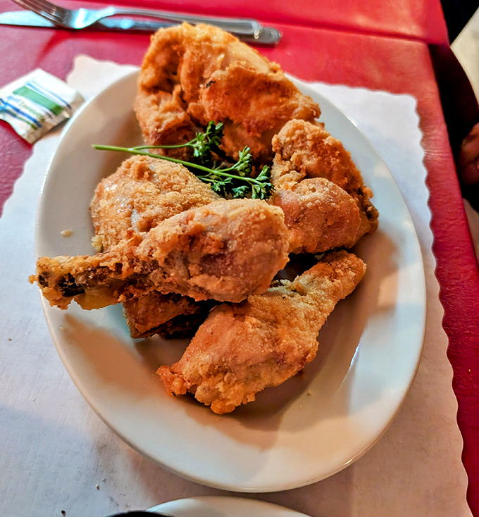 Fried chicken that would make Colonel Sanders weep with jealousy—crackling skin giving way to juicy meat that practically demands a second helping.