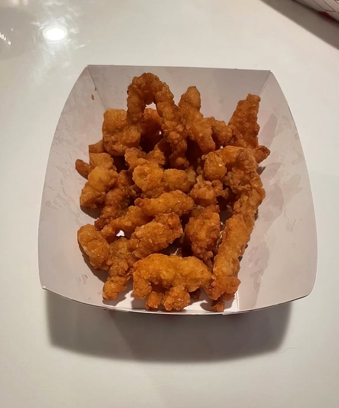 These golden nuggets of fried goodness aren't just clams—they're little oceanic treasures that crunch like nature's potato chips with ten times the flavor.