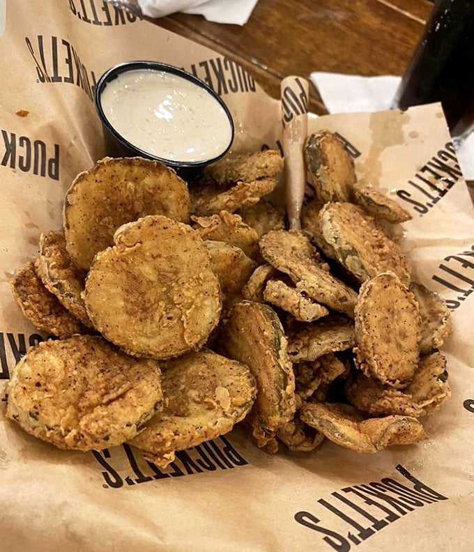 These aren't just fried pickles – they're crunchy little discs of happiness, waiting to take a dip in that creamy sauce of dreams.