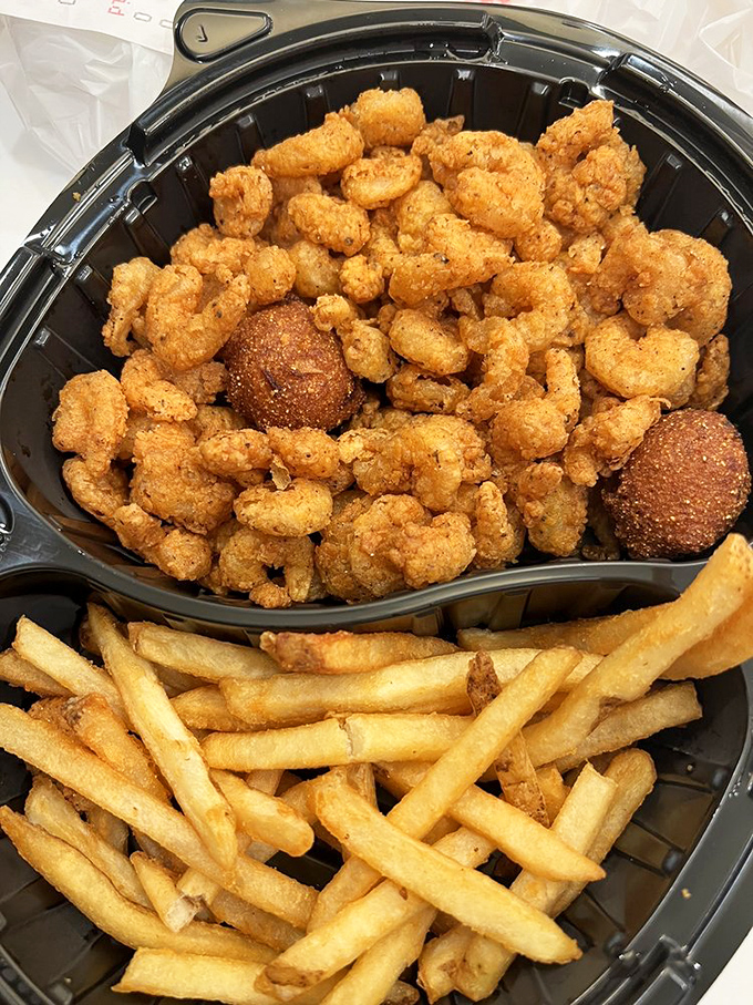 Golden-fried shrimp and hushpuppies—the dynamic duo of Gulf Coast comfort. This basket contains more happiness than most people experience in an entire day.