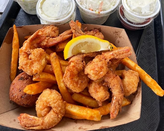 Golden-fried shrimp that snap when you bite them, paired with hand-cut fries and a wedge of lemon. Simple pleasures are often the most profound.