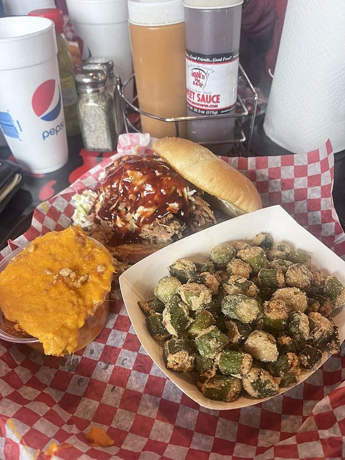 Sweet potato casserole, BBQ sandwich, and fried okra—the holy trinity of Southern comfort. Diet books weep silently in the distance.