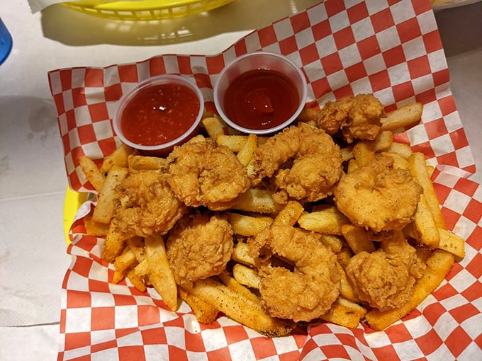 Golden-fried shrimp nestled among french fries—proof that sometimes the simplest combinations make for the most satisfying indulgences.