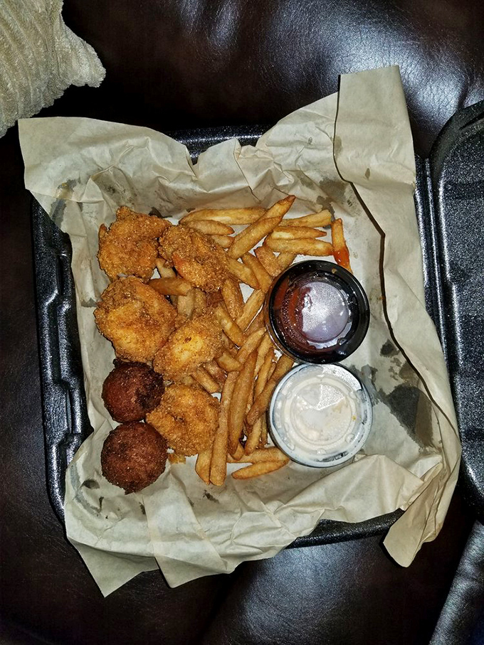 Golden-fried treasures nestled beside crispy fries—proof that sometimes the simplest pleasures deliver the most profound satisfaction.