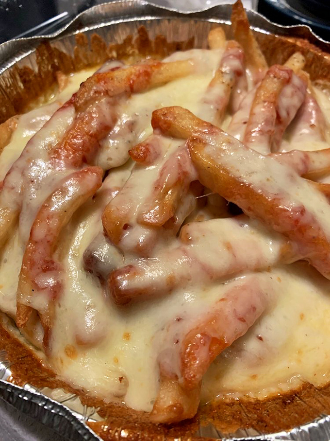 Cheese fries that make you question why anyone would ever eat them any other way—golden, crispy, and draped in a molten cheese embrace.