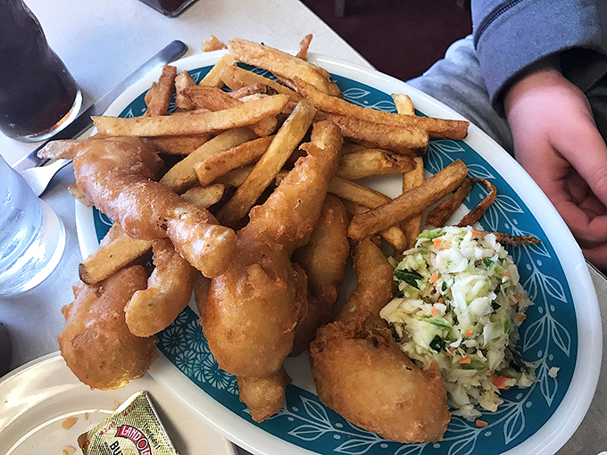 The onion rings at Scotty's aren't just side dishes—they're golden halos of crispy perfection that might make you forget about the fish. Almost.