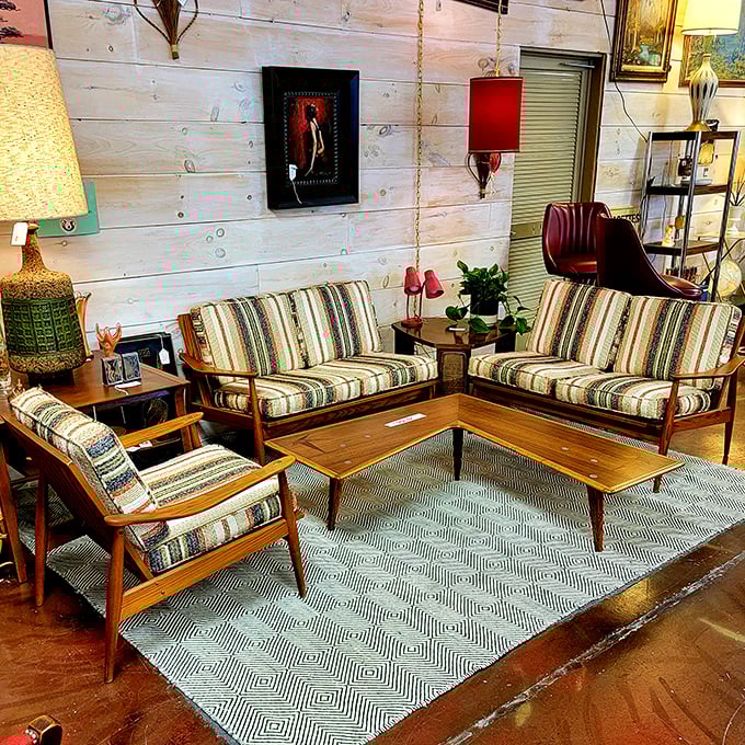 This living room setup isn't just furniture—it's a mid-century modern support group ready to cradle your streaming marathons in style.