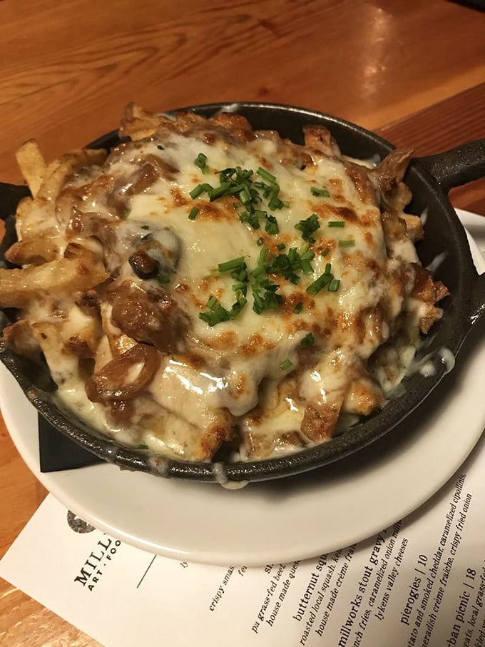 Poutine's sophisticated Pennsylvania cousin—crispy fries swimming in melted cheese that stretches like the final minutes of a championship game.