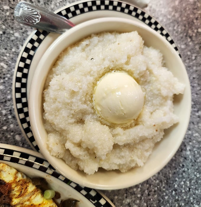 Behold the humble grits—transformed from simple cornmeal into a buttery cloud of Southern comfort. Worth every mile of the drive.