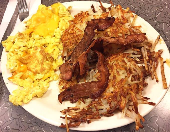 Breakfast of champions! Crispy hash browns with the ideal crunch-to-tender ratio, eggs cooked just right, and bacon that could make a vegetarian weep.