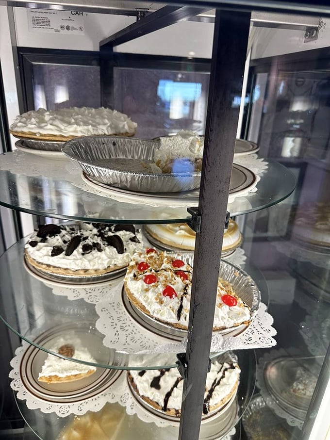 The rotating pie display case—where calories don't count because you're technically still on vacation.