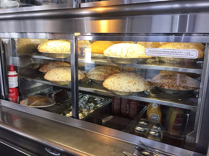 The pie case – where willpower goes to die. Each golden crust holds the promise of a better tomorrow.