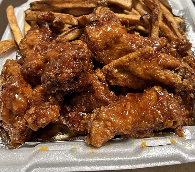 Honey lemon pepper wings glistening like amber jewels, sweet heat that'll make your taste buds tango.