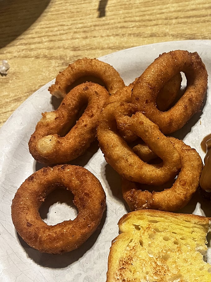 Hushpuppies that could make a Southerner weep with joy—crispy exterior giving way to that perfect cornmeal interior. Comfort food defined.