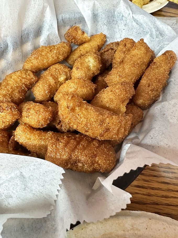 These golden-brown hush puppies aren't just side dishes—they're crunchy little cornmeal messengers from the South saying "y'all are welcome here."