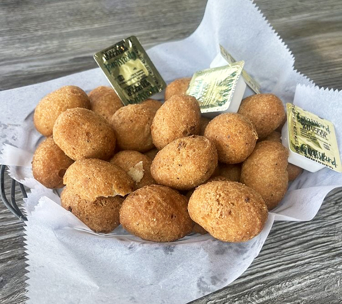 Hush puppies so perfectly golden and round, they deserve their own Instagram account. Southern comfort in bite-sized form.
