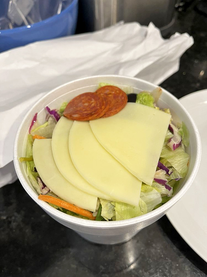 This isn't just a side salad—it's a supporting actor deserving its own award. Crisp, colorful, and topped with provolone that means business.
